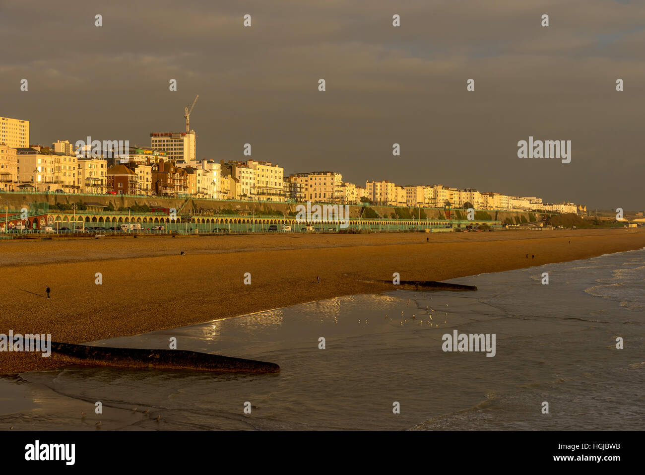 Golden light on the seafront at Brighton making the Regency buildings ...