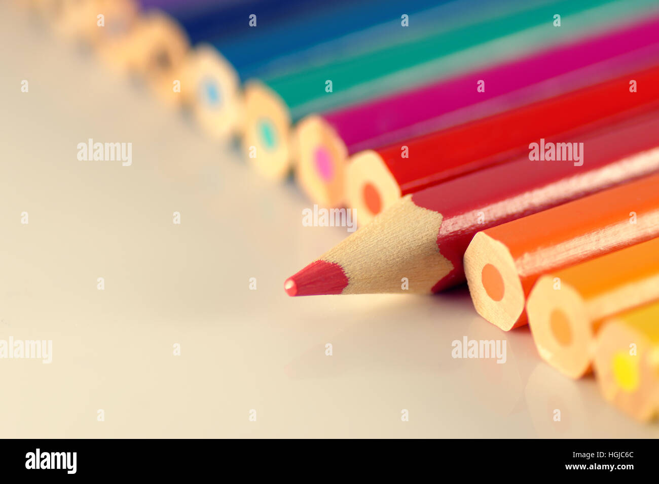 Line of colorful pencils with one individual pencil Stock Photo - Alamy