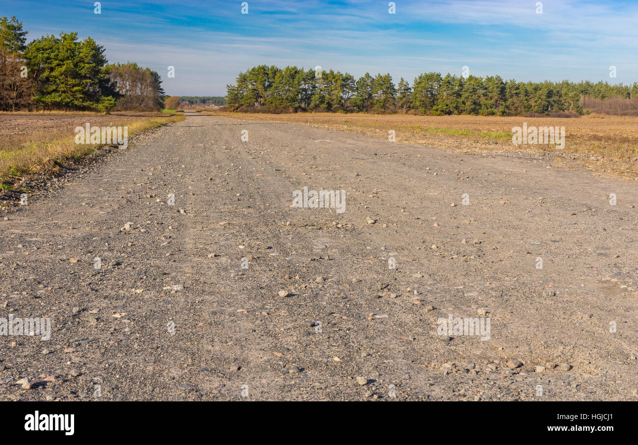 Fall landscape with country macadam road leading to remote Ukrainian ...