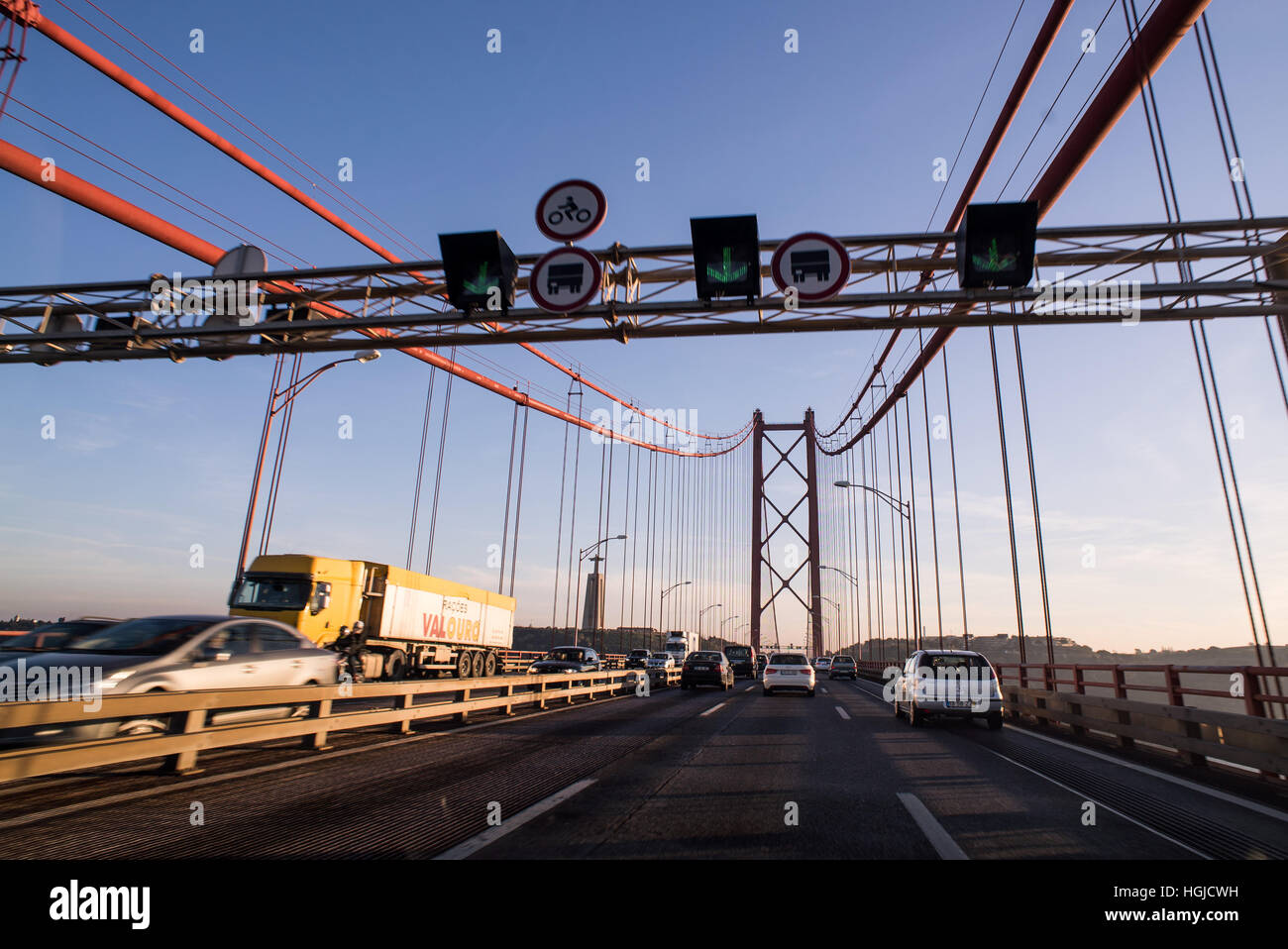 crossing the Ponte 25 de Abril bridge in Lisbon, Portugal Stock Photo ...