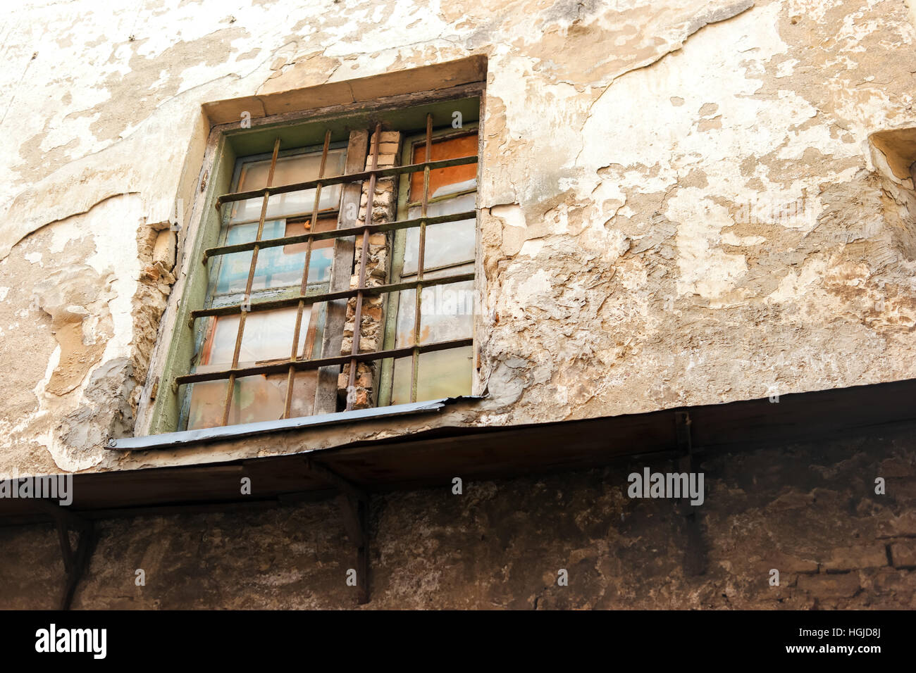 Wall and window with bars Stock Photo - Alamy
