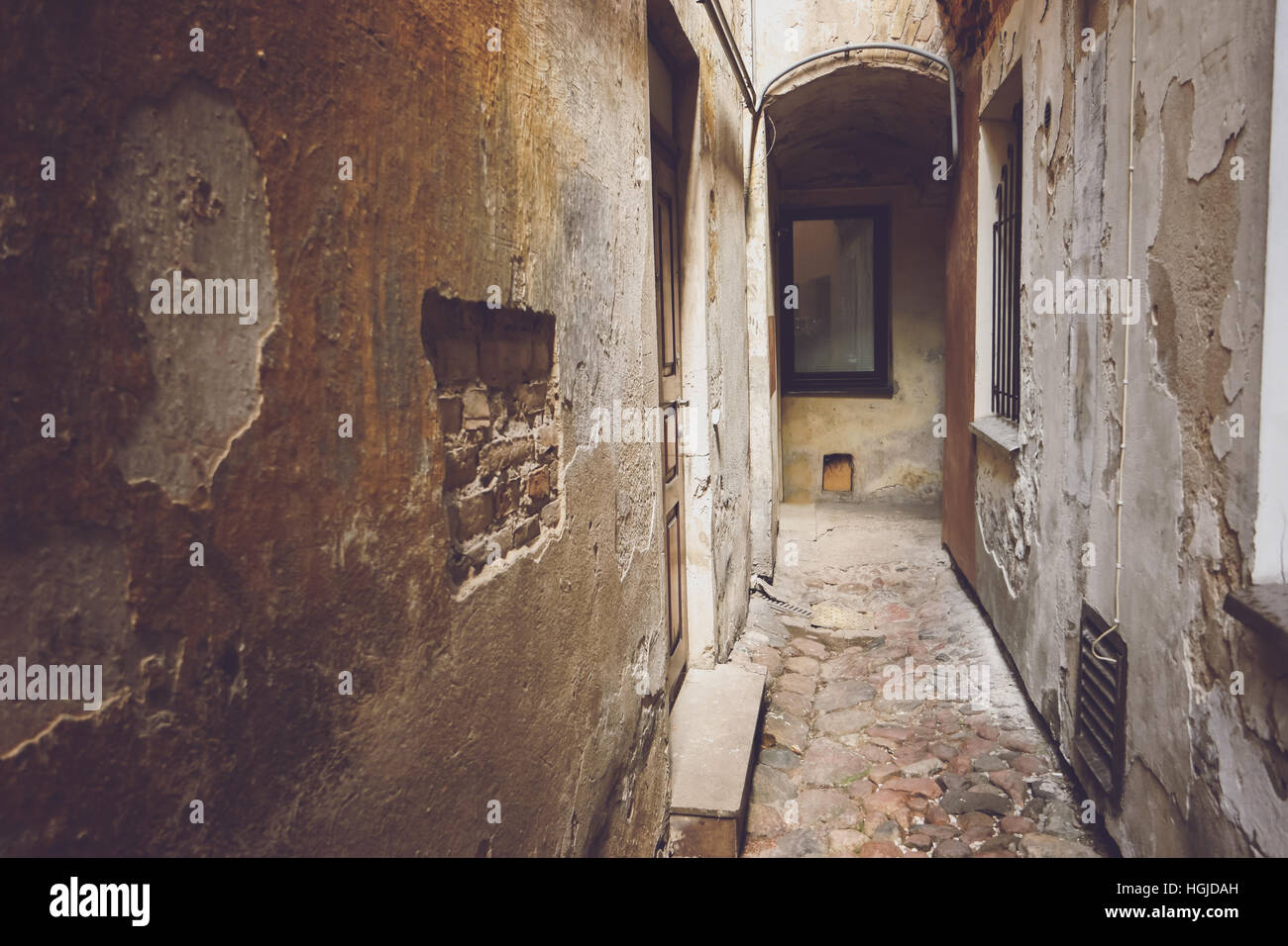 Narrow path between buildings Stock Photo - Alamy