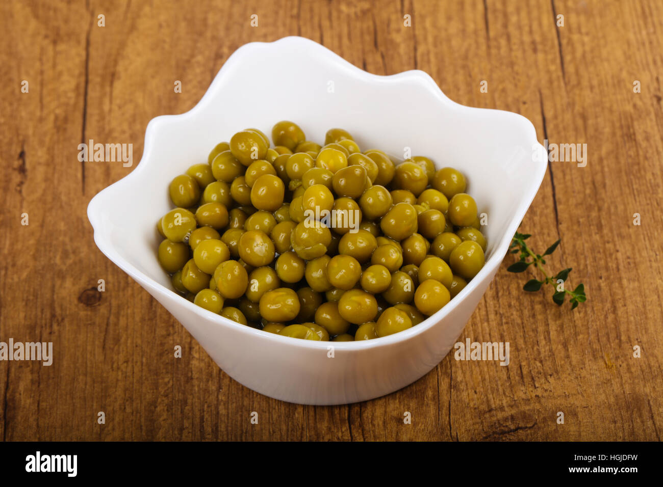 Pickled pea in the plate over wooden background Stock Photo - Alamy