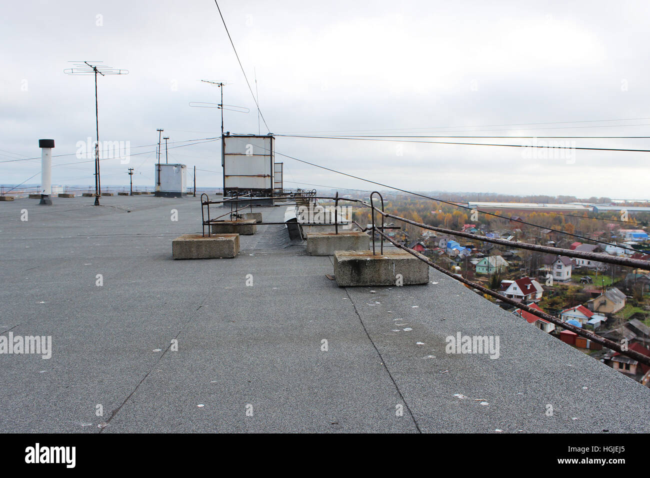 Ruberoid roof covering and railing on a multi-storey town house in ...