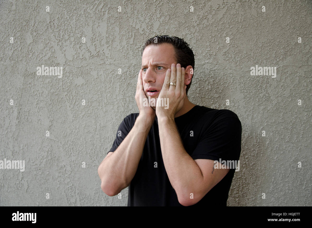 Shocked man alone hands on hi-res stock photography and images - Alamy