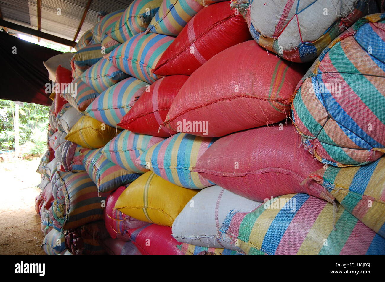 Stacks of colourful rice bags Stock Photo - Alamy