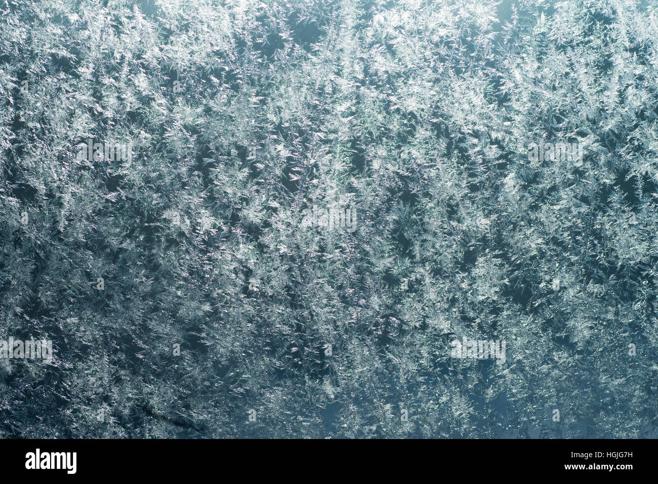 frost pattern on glass winter background texture Stock Photo - Alamy