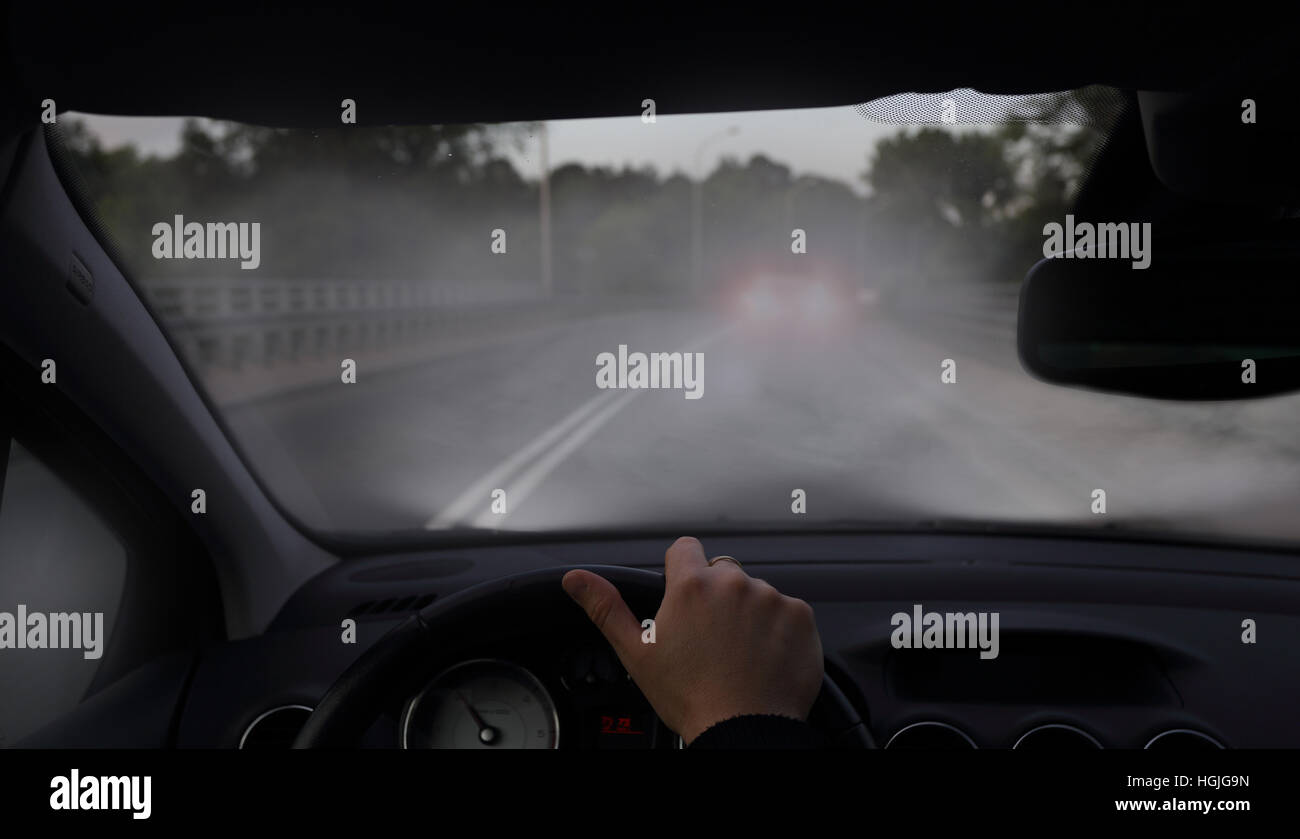 Driving car in fog Stock Photo - Alamy
