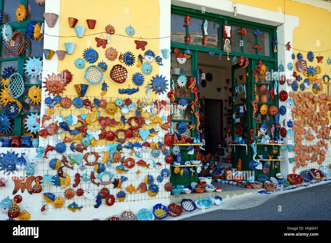 Pottery displayed on the wall of a shop in the village centre ...