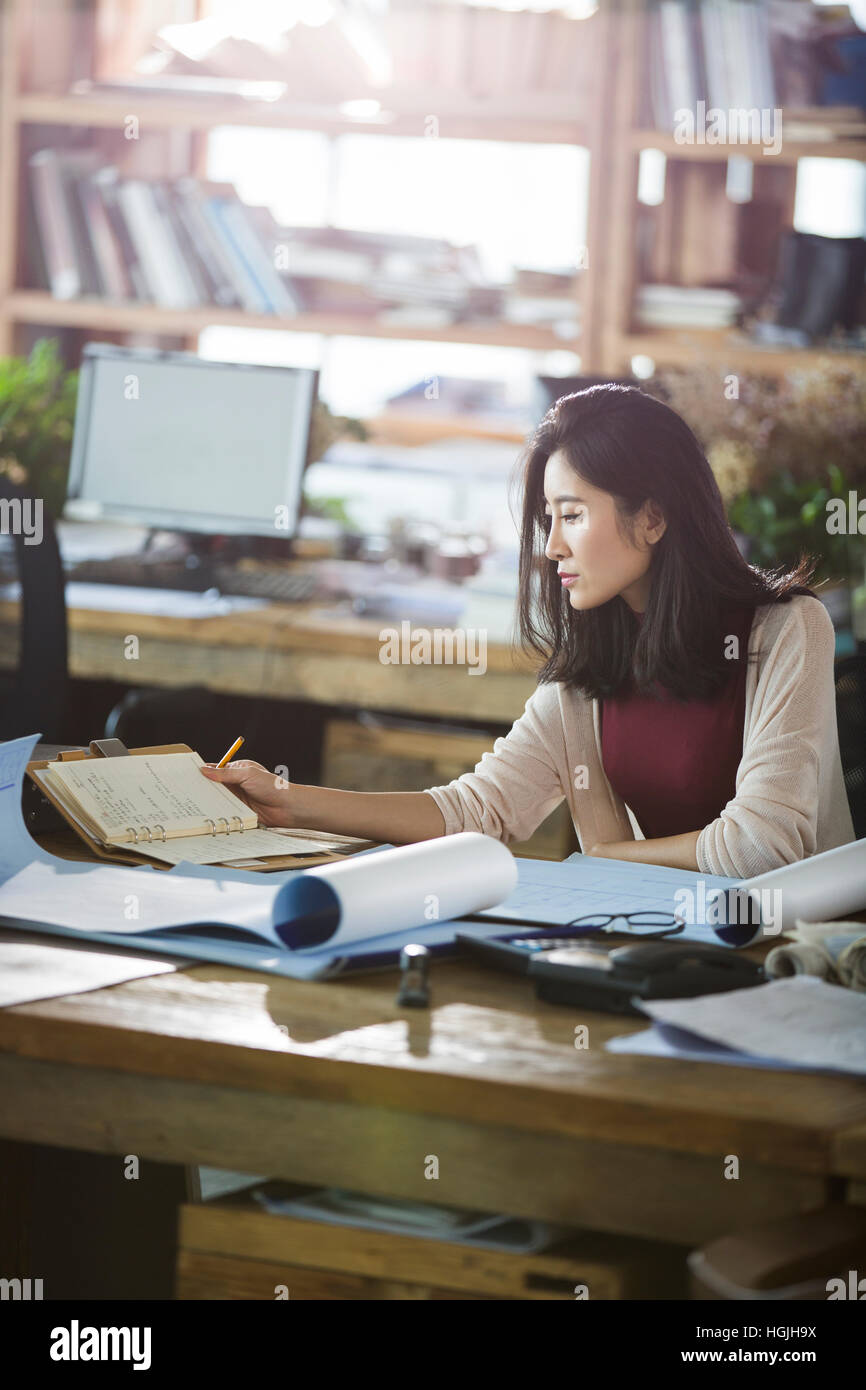 Female architect working in the office Stock Photo - Alamy