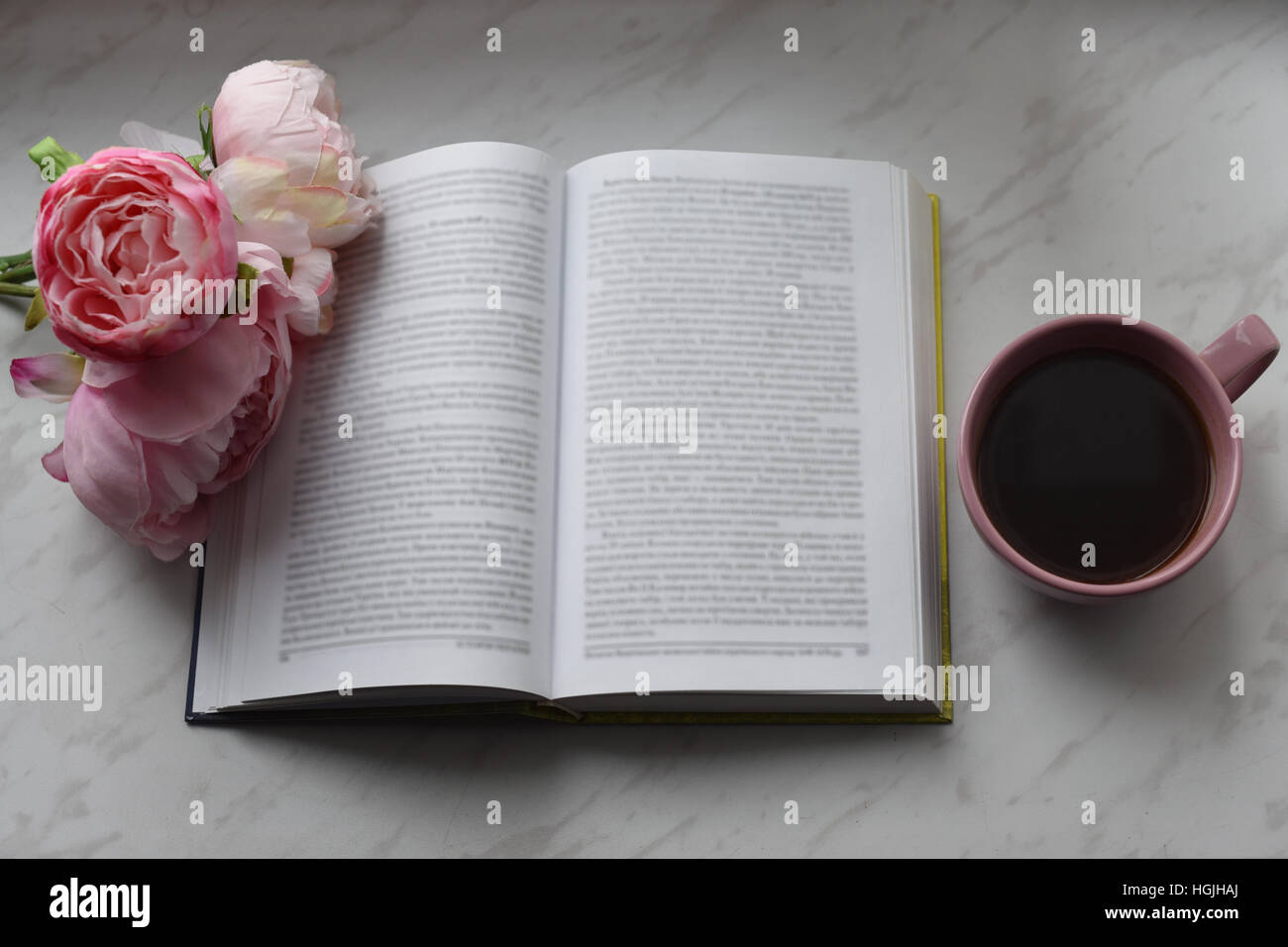 Cozy home still life: cup of hot coffee, spring flowers and opened book ...