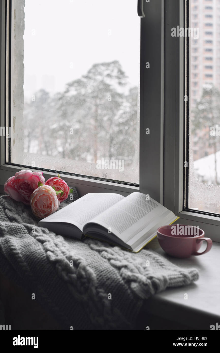 Cozy home still life: cup of hot coffee, spring flowers and opened book ...