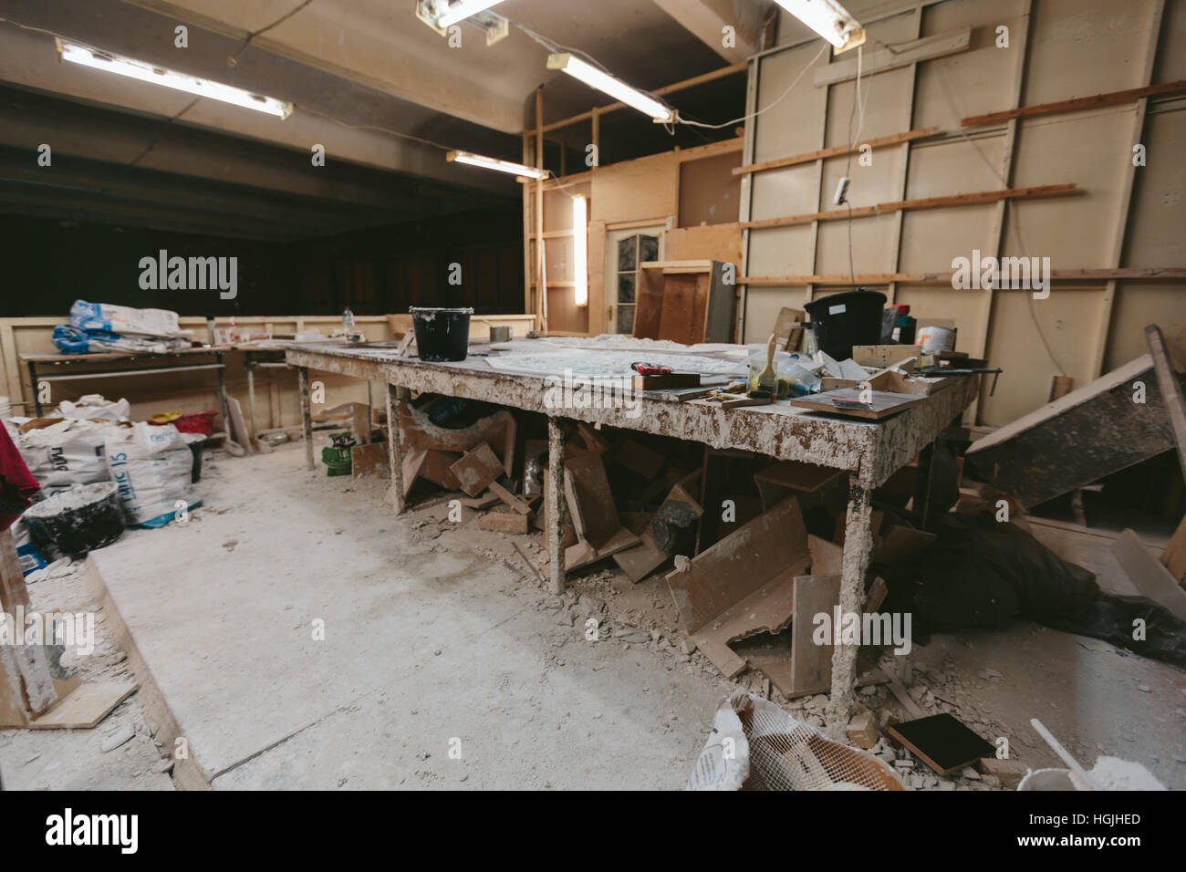 Factory for Production of plaster molds. cluttered dusty old warehouse ...