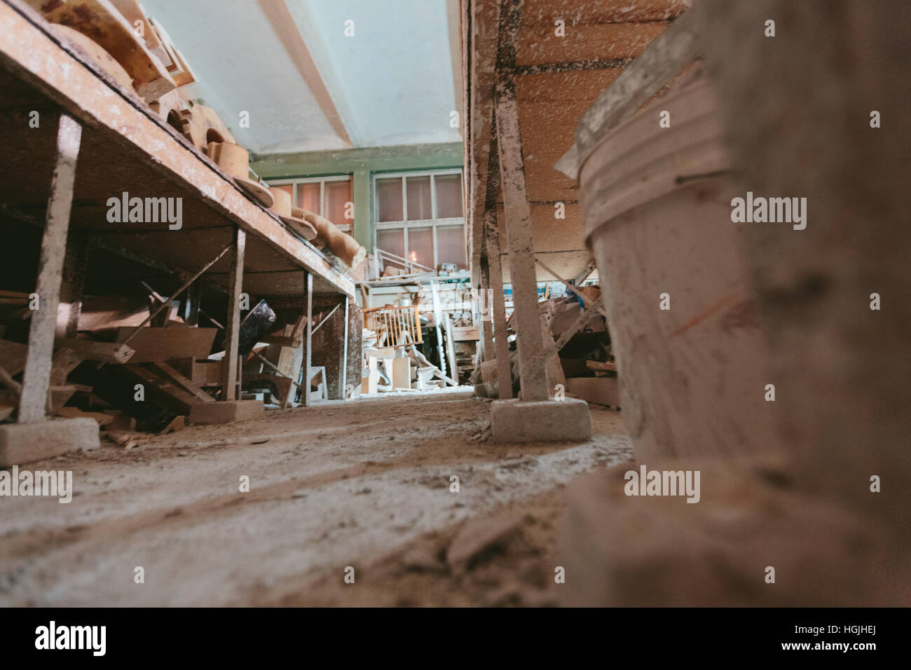 Factory for Production of plaster molds. cluttered dusty old warehouse ...