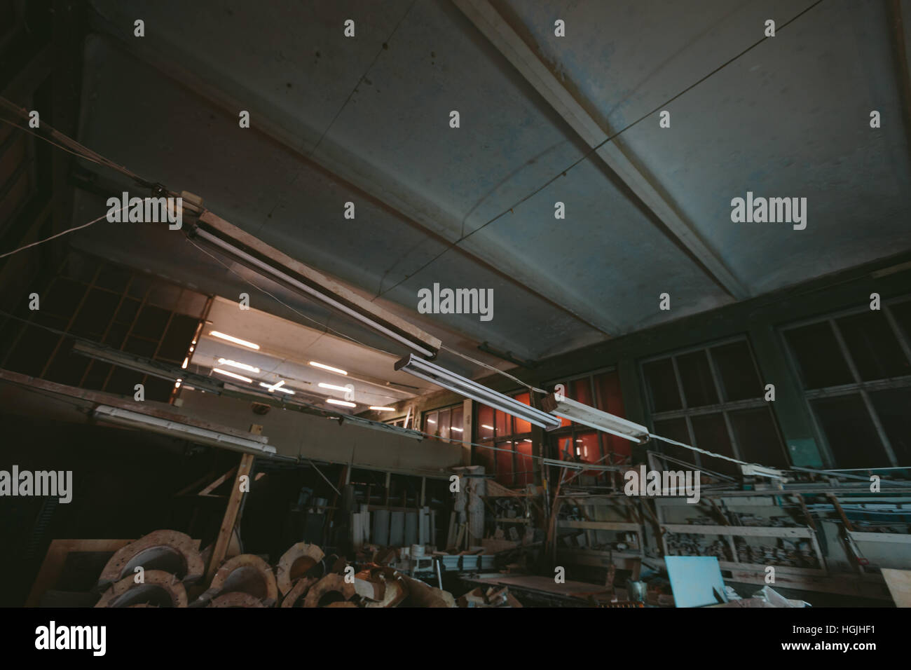 Factory for Production of plaster molds. cluttered dusty old warehouse ...