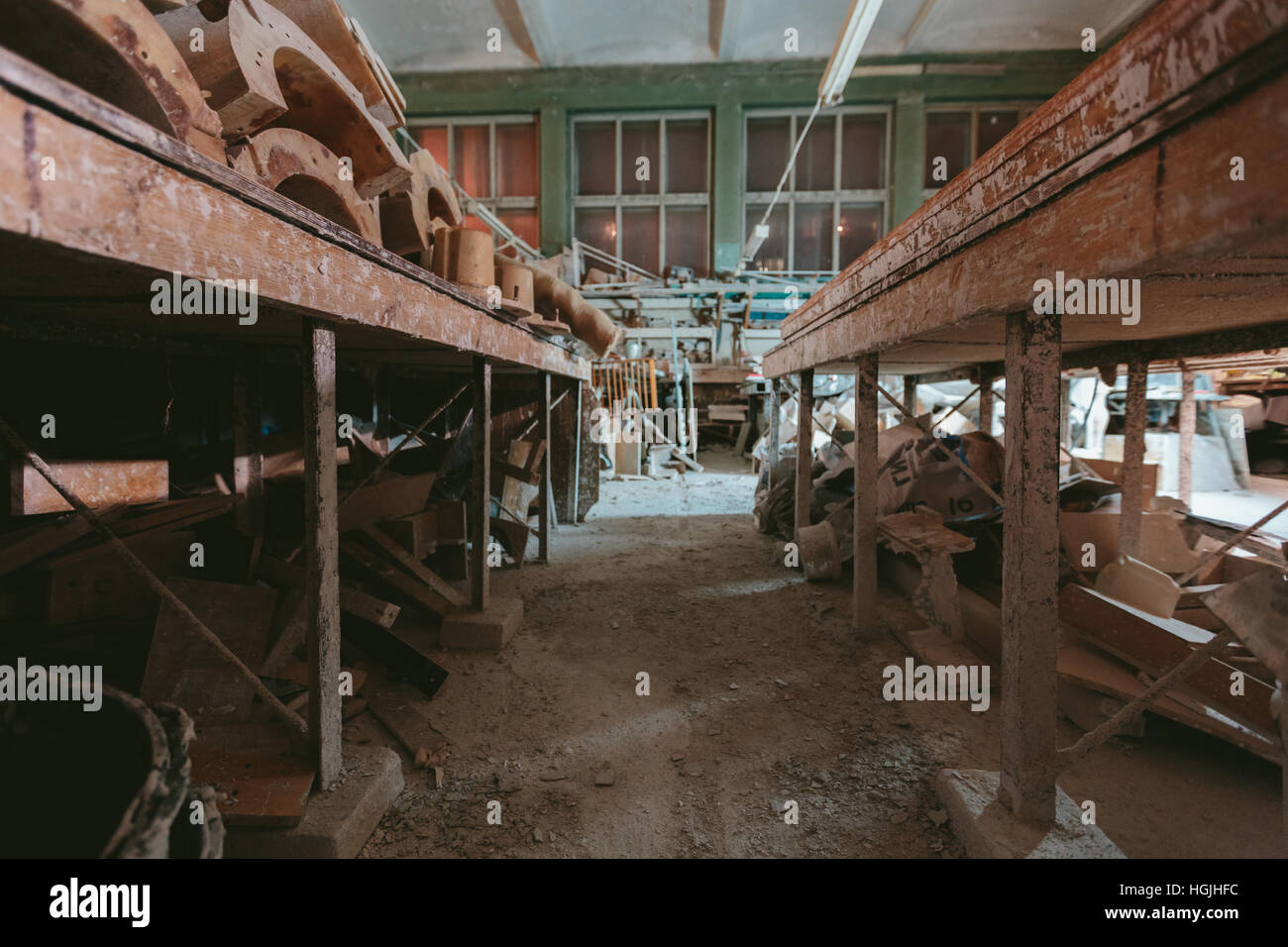 Factory for Production of plaster molds. cluttered dusty old warehouse ...
