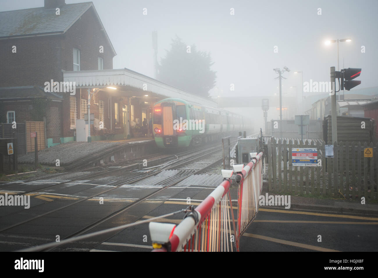 On a foggy morning, a Southern Rail train waits at Angmering Train ...