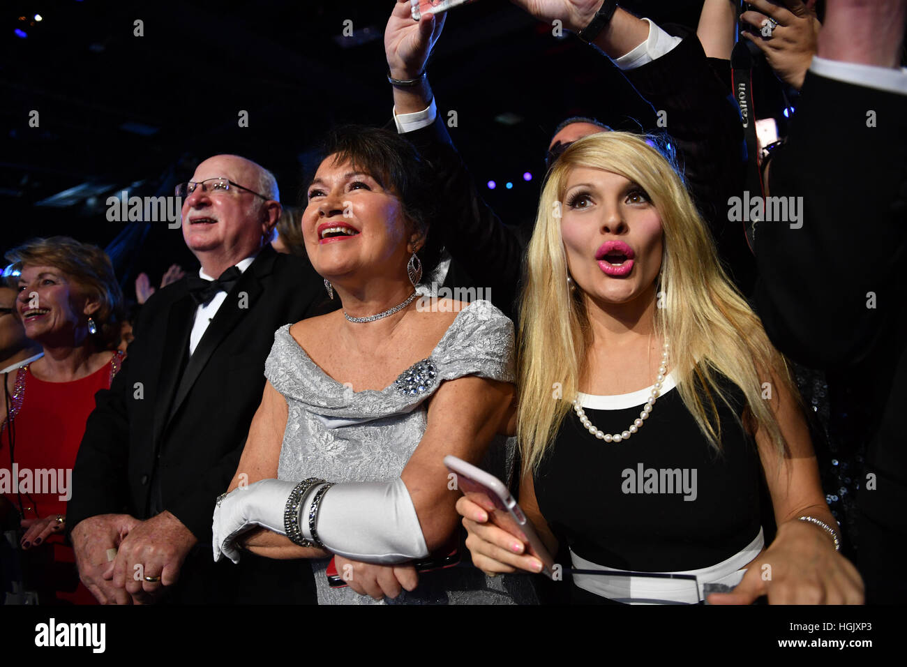 Supporters cheer President Donald Trump and First Lady Melania Trump at ...