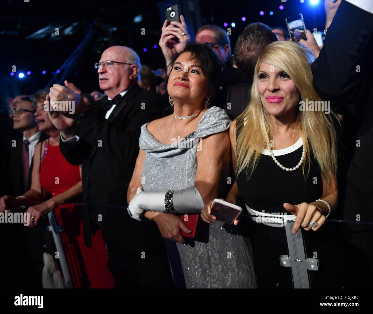 Supporters watch President Donald Trump and First Lady Melania Trump at ...