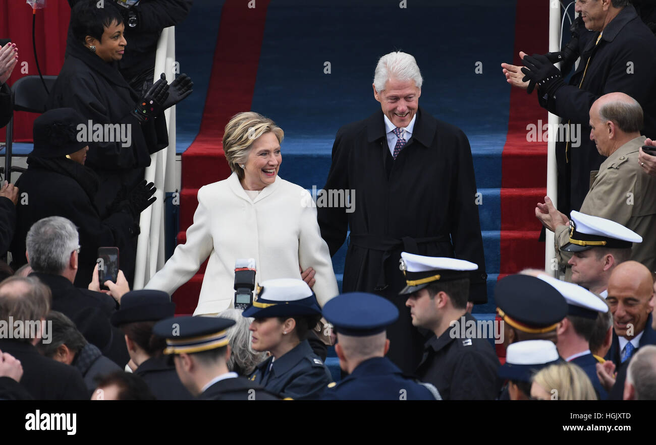 Former President Bill Clinton and wife Hillary Clinton walk down the ...