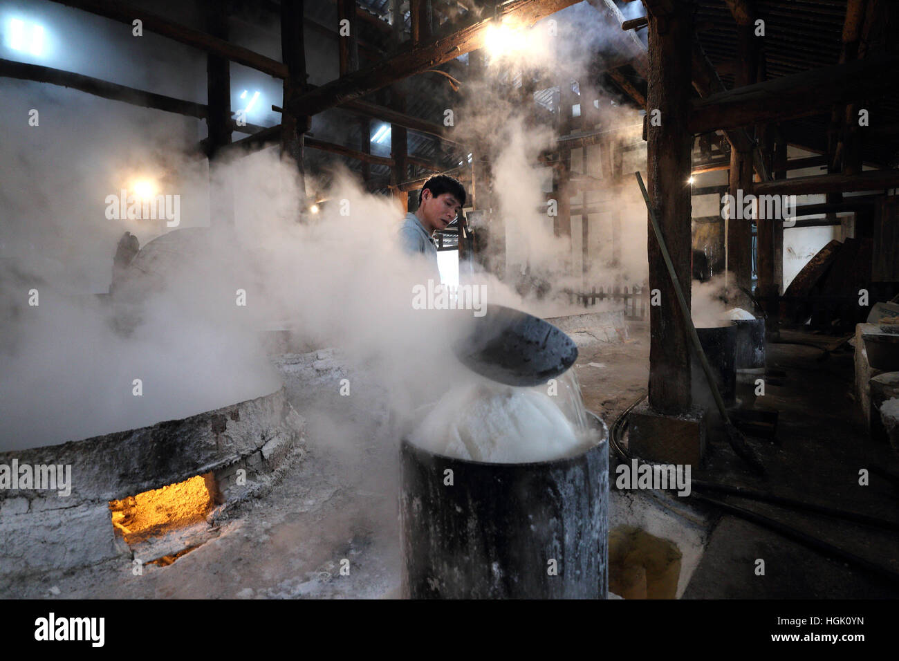 Zigong, China's Sichuan Province. 23rd Jan, 2017. A worker processes ...