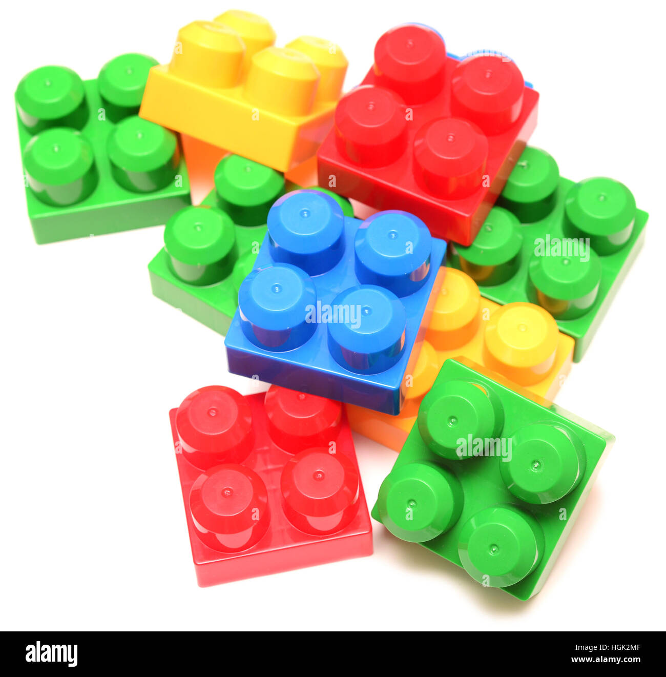 Colorful stacked toy plastic building blocks isolated on white ...