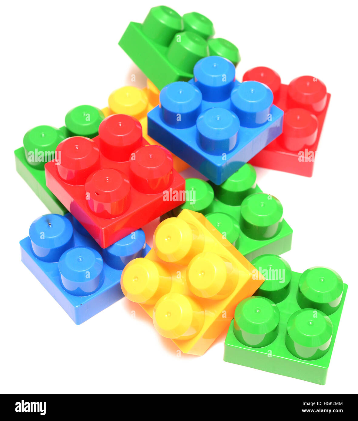 Colorful stacked toy plastic building blocks isolated on white ...
