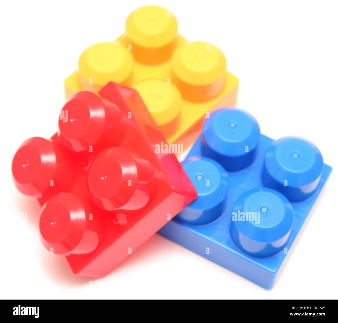 Colorful stacked toy plastic building blocks isolated on white ...