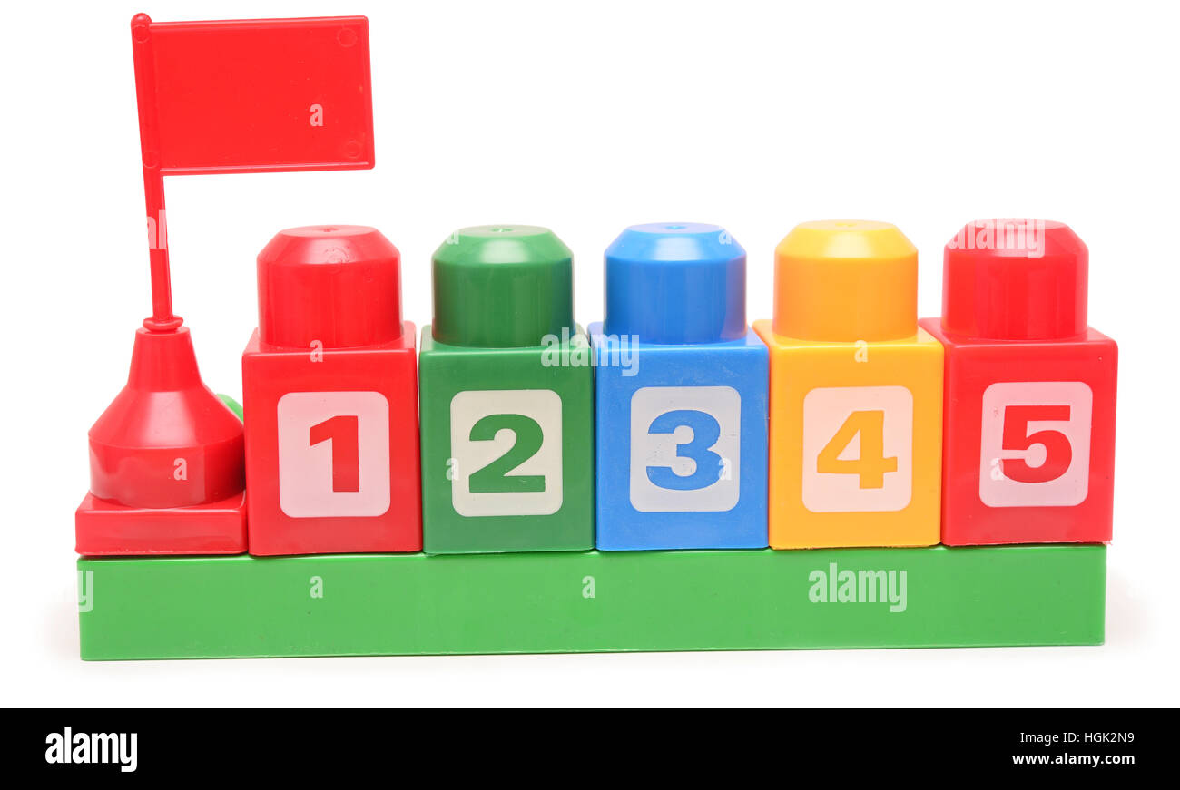 Colorful stacked toy plastic building blocks isolated on white ...