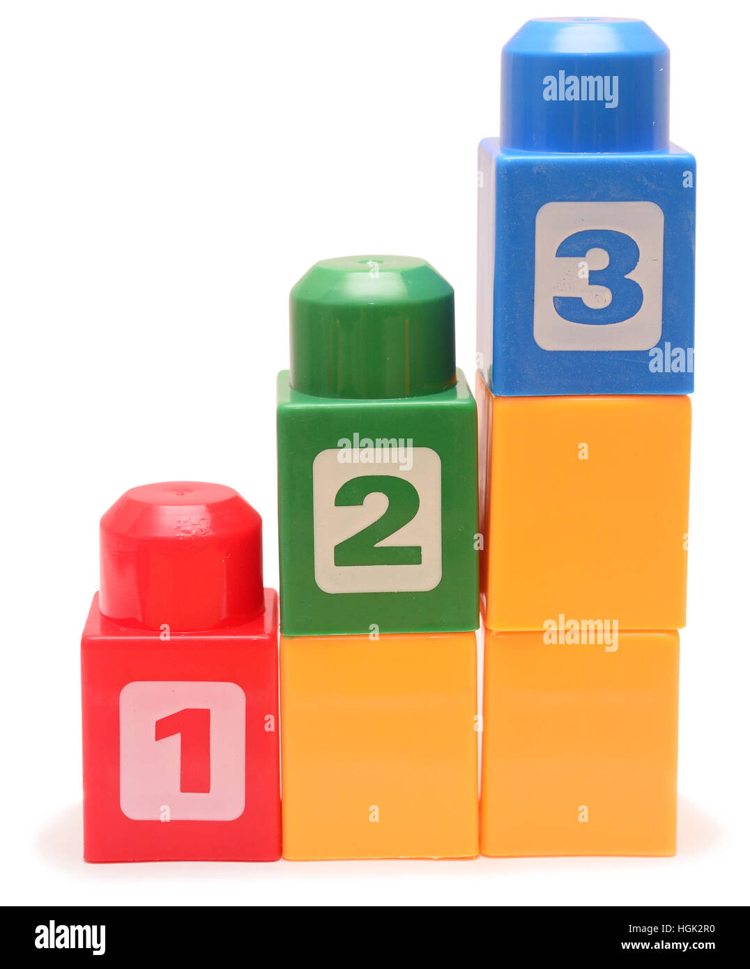 Colorful stacked toy plastic building blocks isolated on white ...