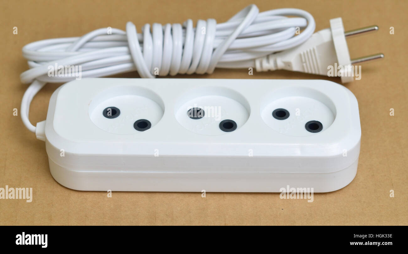 Plugged in electric devices in an extension cord Stock Photo - Alamy