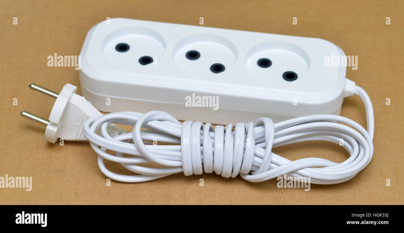 Plugged in electric devices in an extension cord Stock Photo - Alamy