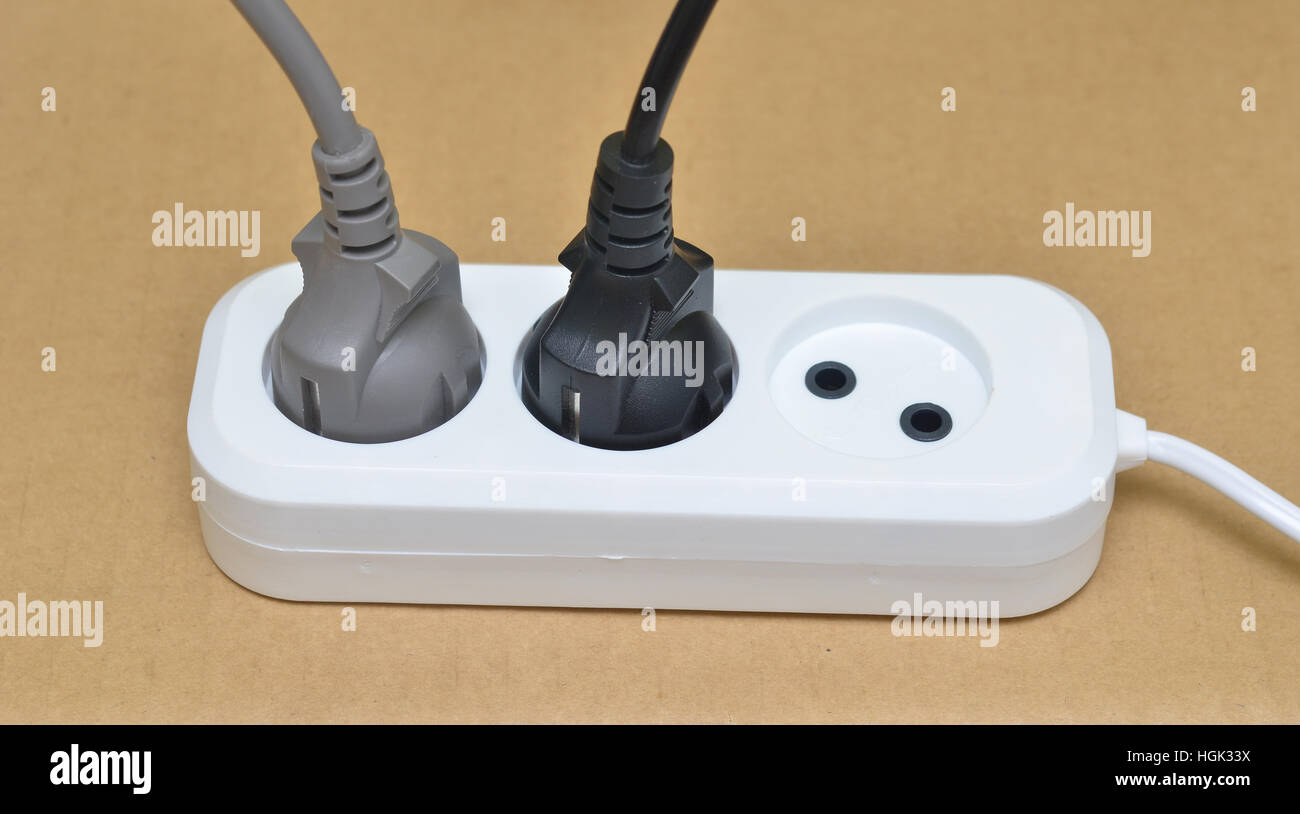 Plugged in electric devices in an extension cord Stock Photo - Alamy