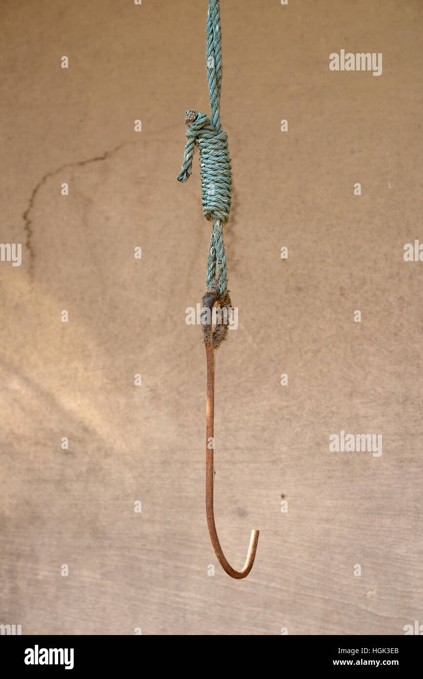 tied rope knot and hook Stock Photo - Alamy