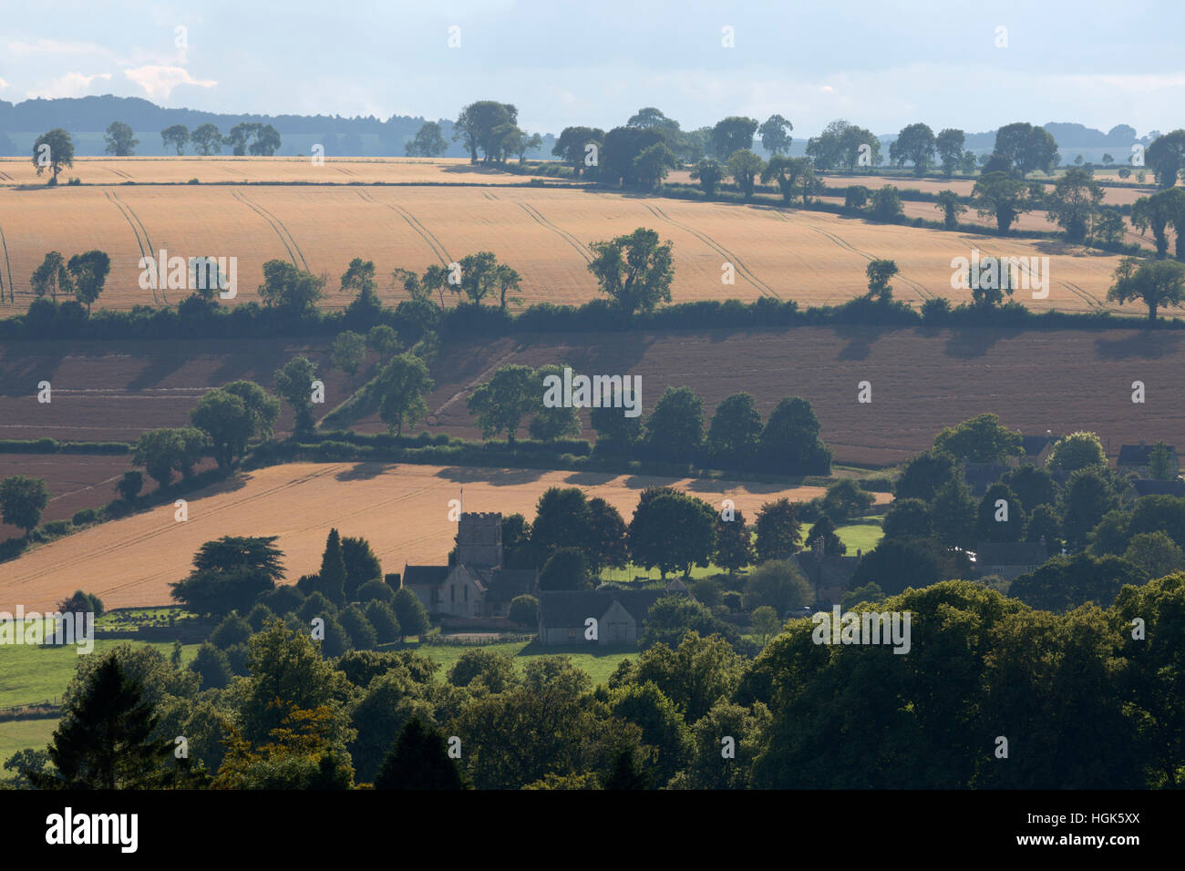 Cotswold farmland and St Michael's and All Angels church, Guiting Power ...