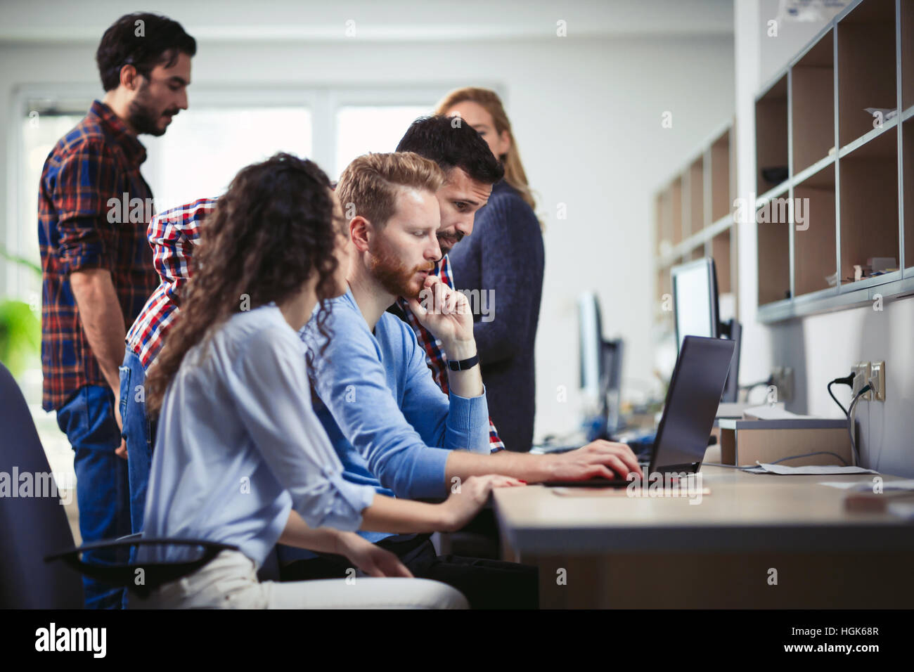Programmers and business people collaborating in company office Stock Photo - Alamy