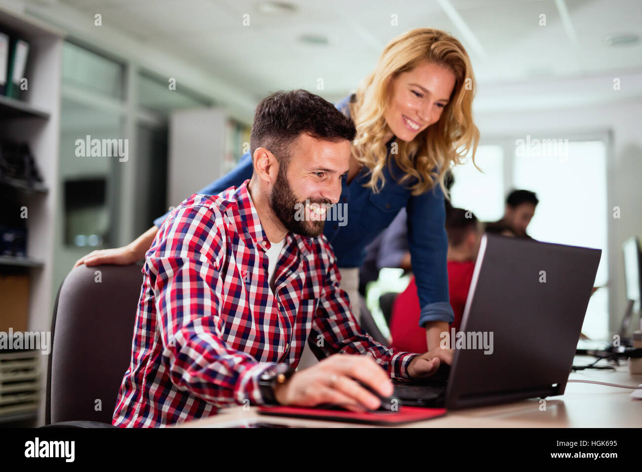 Programmers cooperating at IT company developing apps Stock Photo - Alamy