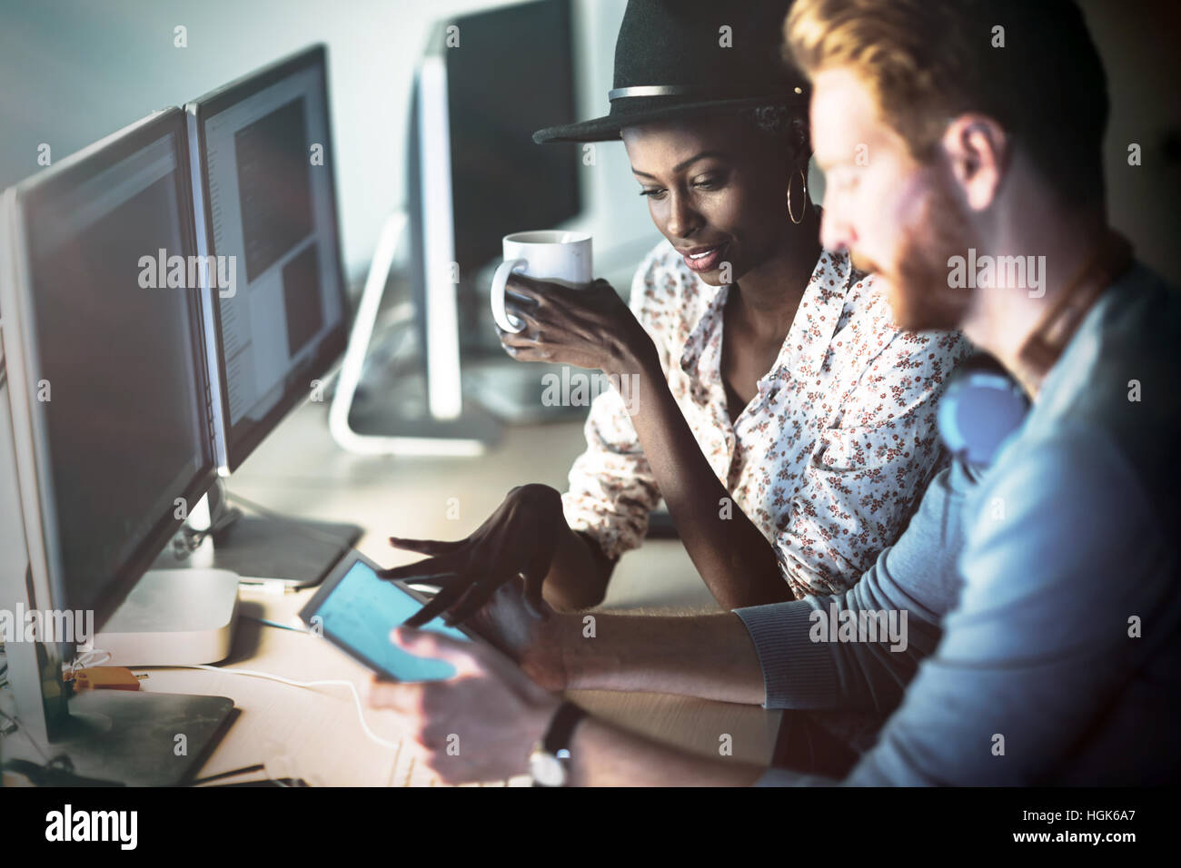 Programmers and business people collaborating in company office Stock Photo - Alamy