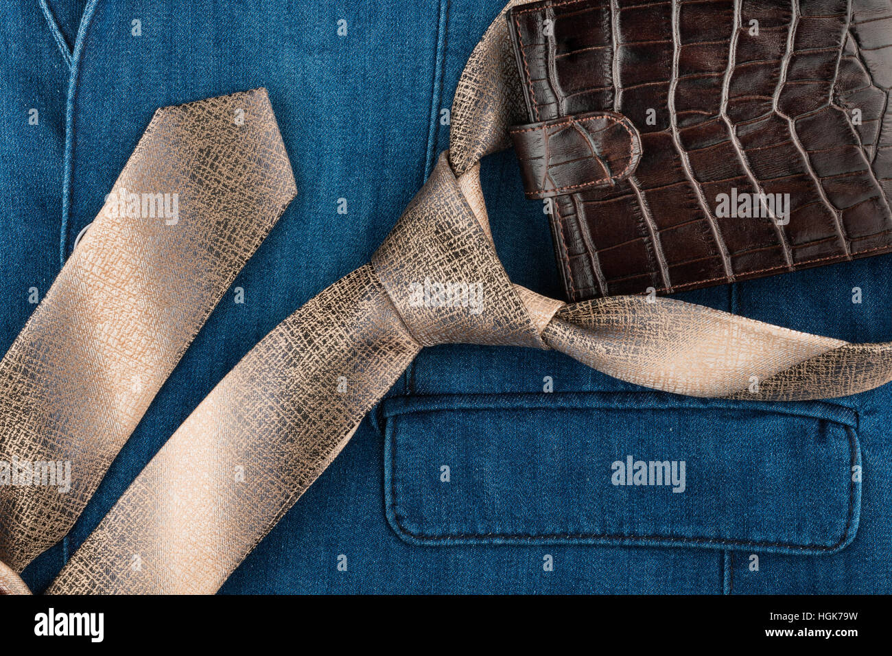 Male tie and wallet lying on denim suit. View from above Stock Photo ...