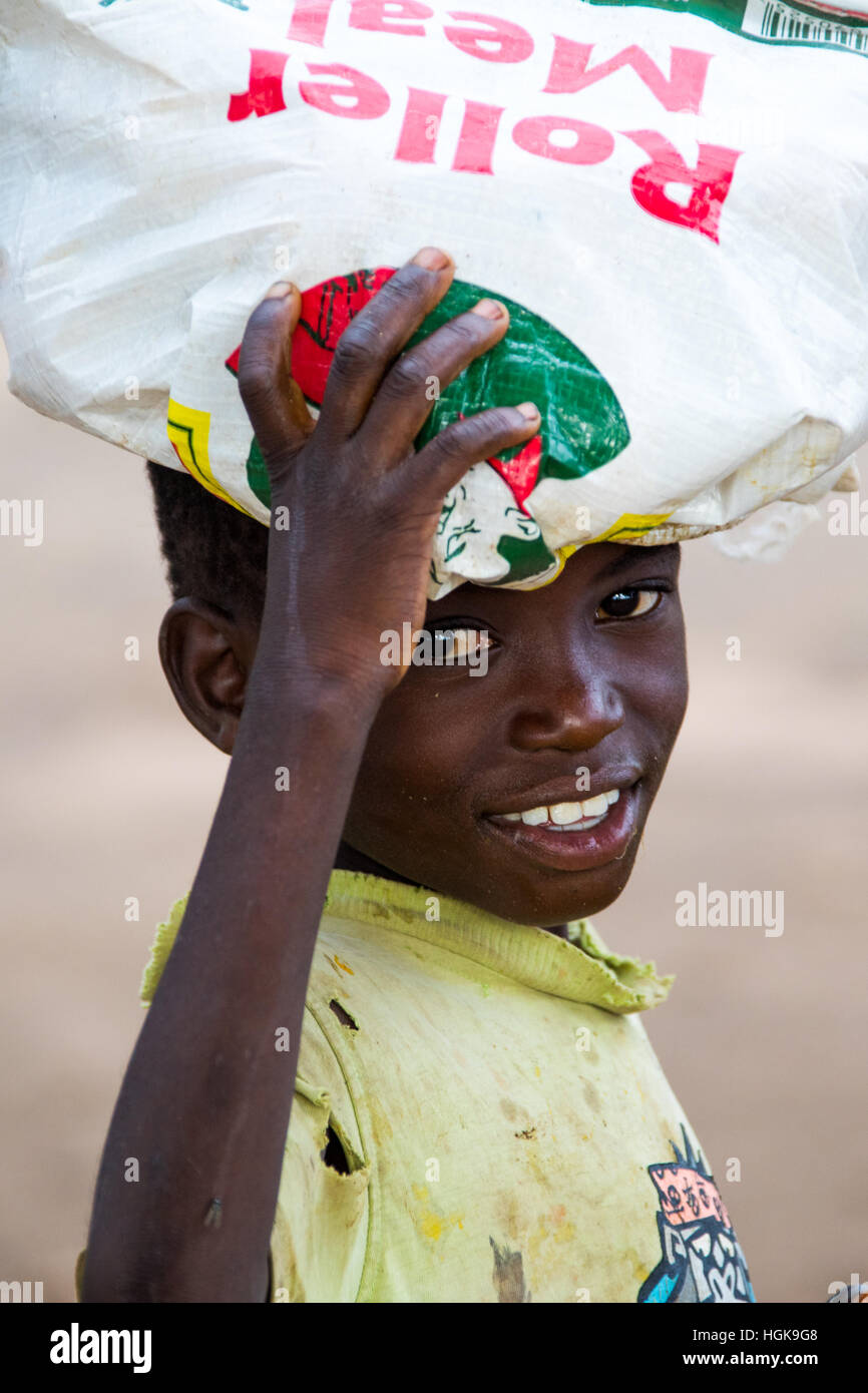 Local boy balancing a bundle, Livingstone, Zambia Stock Photo - Alamy
