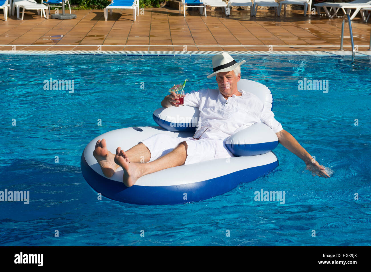 Old man swimming pool hi-res stock photography and images - Alamy