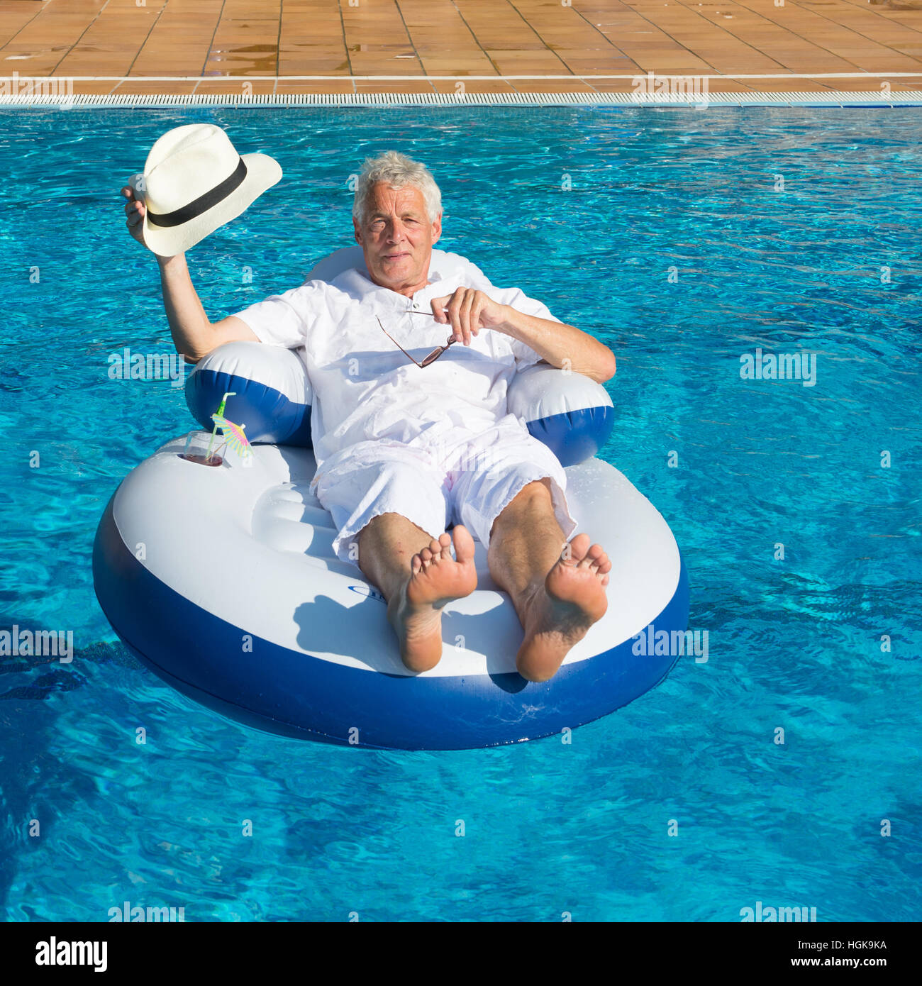 wealthy man relaxing in own swimming pool Stock Photo - Alamy
