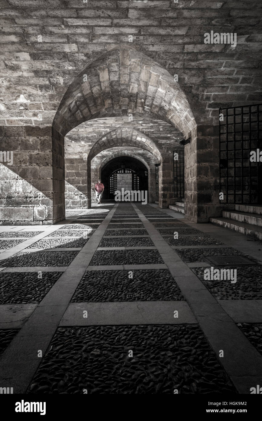 sun with angles and arches with pathway in stone walls and straight ...