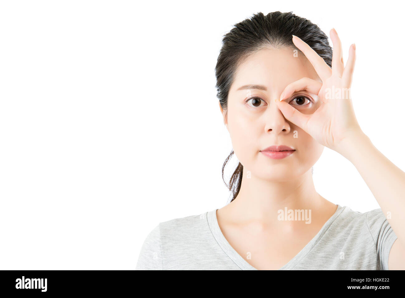 beautiful asian woman show ok gesture for good eye vision. isolated on ...