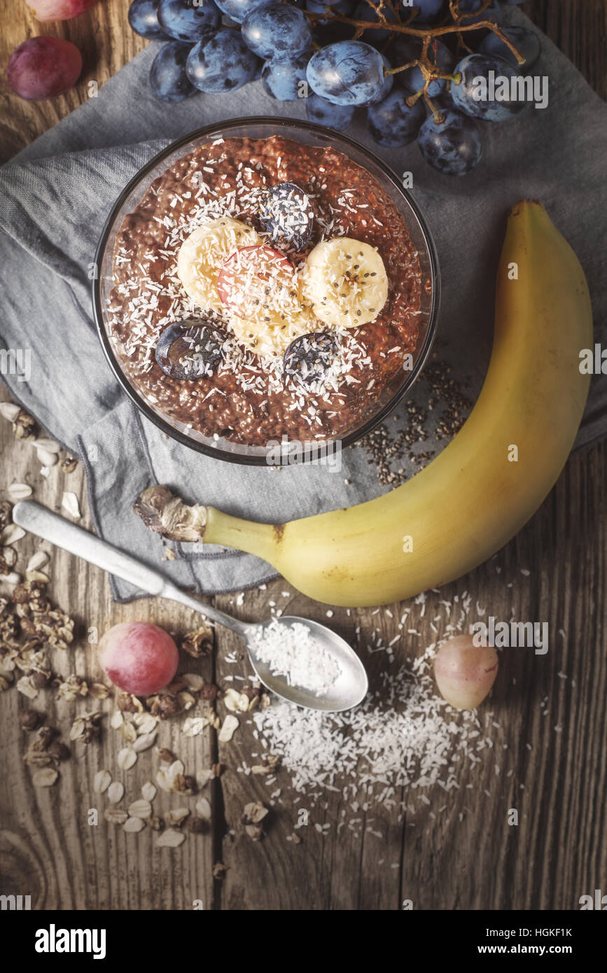 Chocolate chia pudding with fruits on the wooden table top view Stock ...