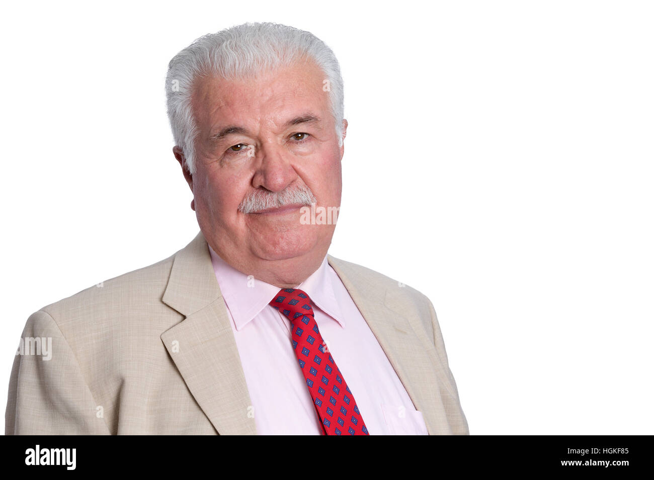 Head and shoulders portrait of mature businessman in cream suit with ...