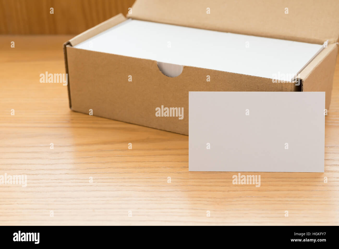 box of business cards with a blank one good for text and logo stands on ...