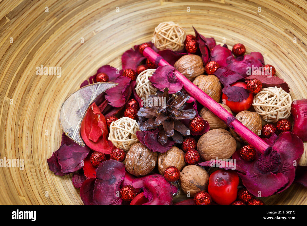 Natural colored decoration of nuts in wooden bowl Stock Photo - Alamy