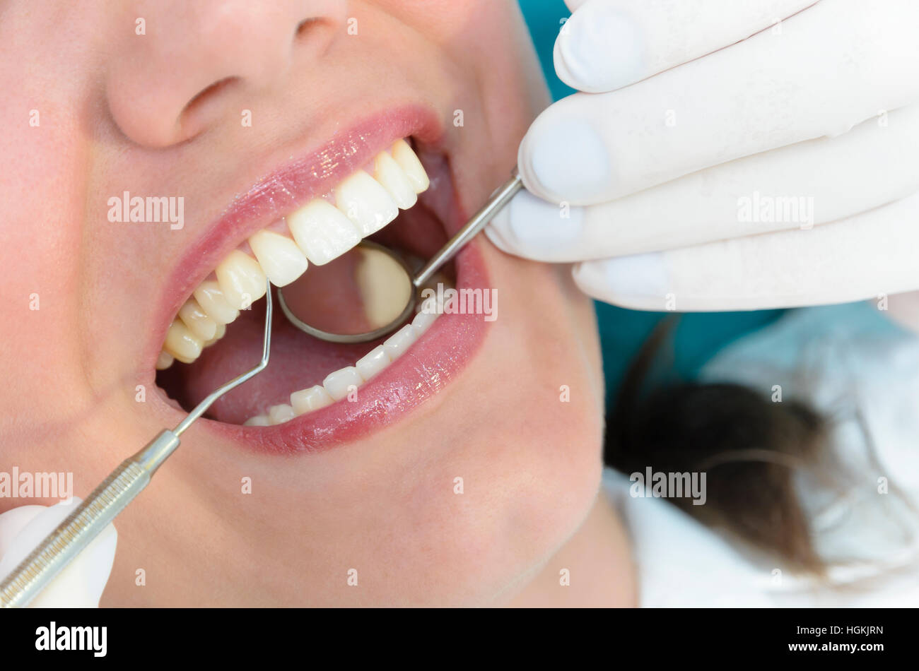 Young woman examining teeth hi-res stock photography and images - Alamy