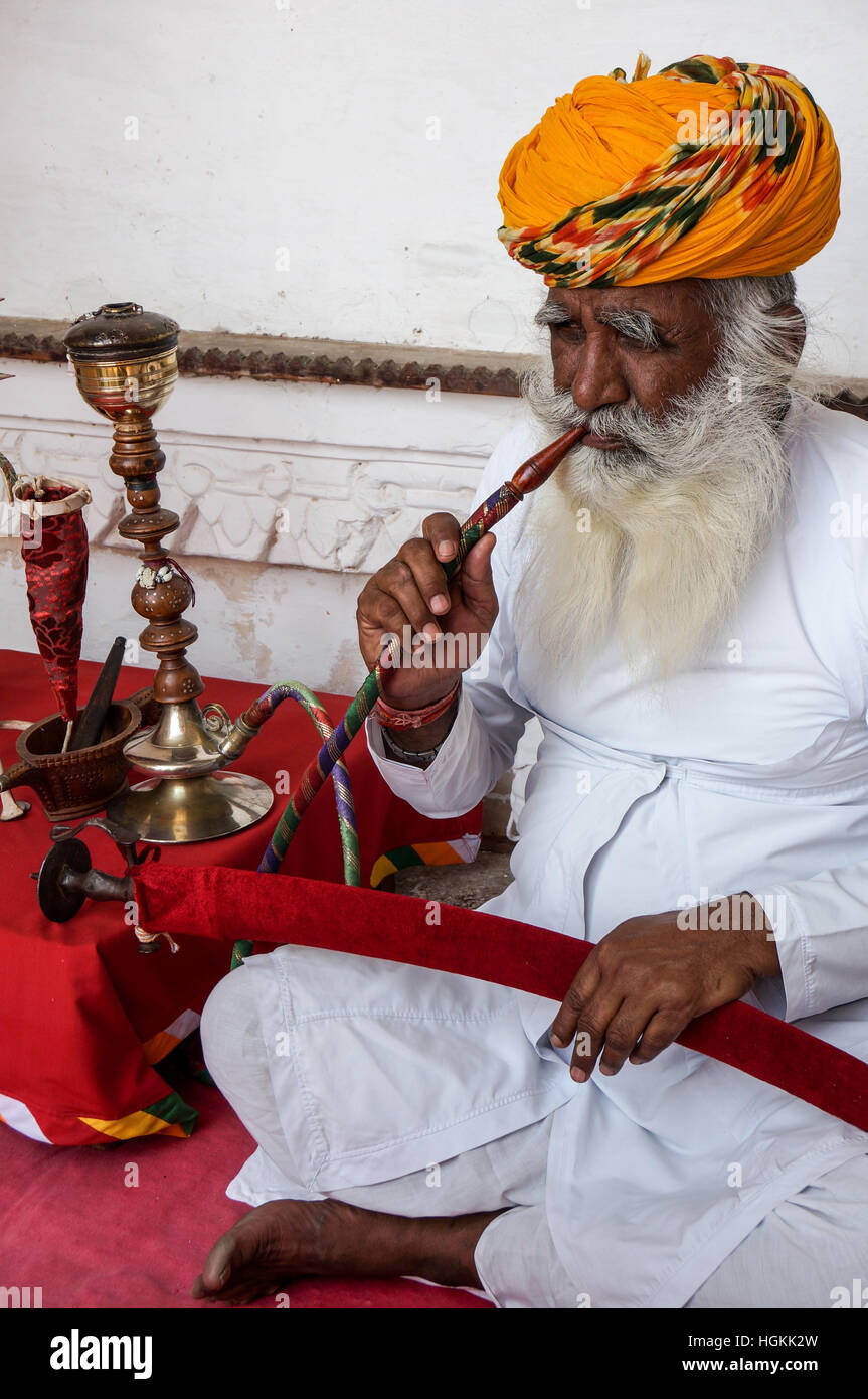 Traditional India gentleman smoking a pipe, India Stock Photo - Alamy
